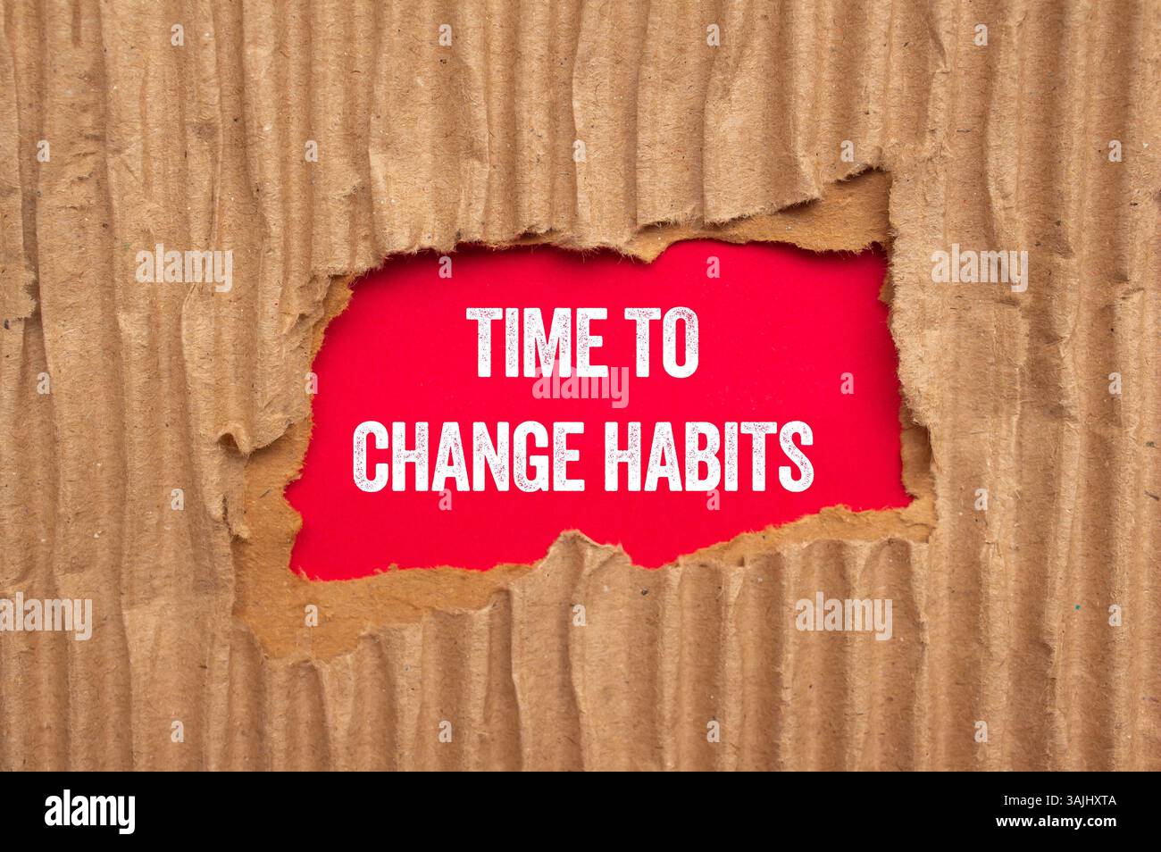 Time to change habits message written on ripped torn cardboard paper on ...