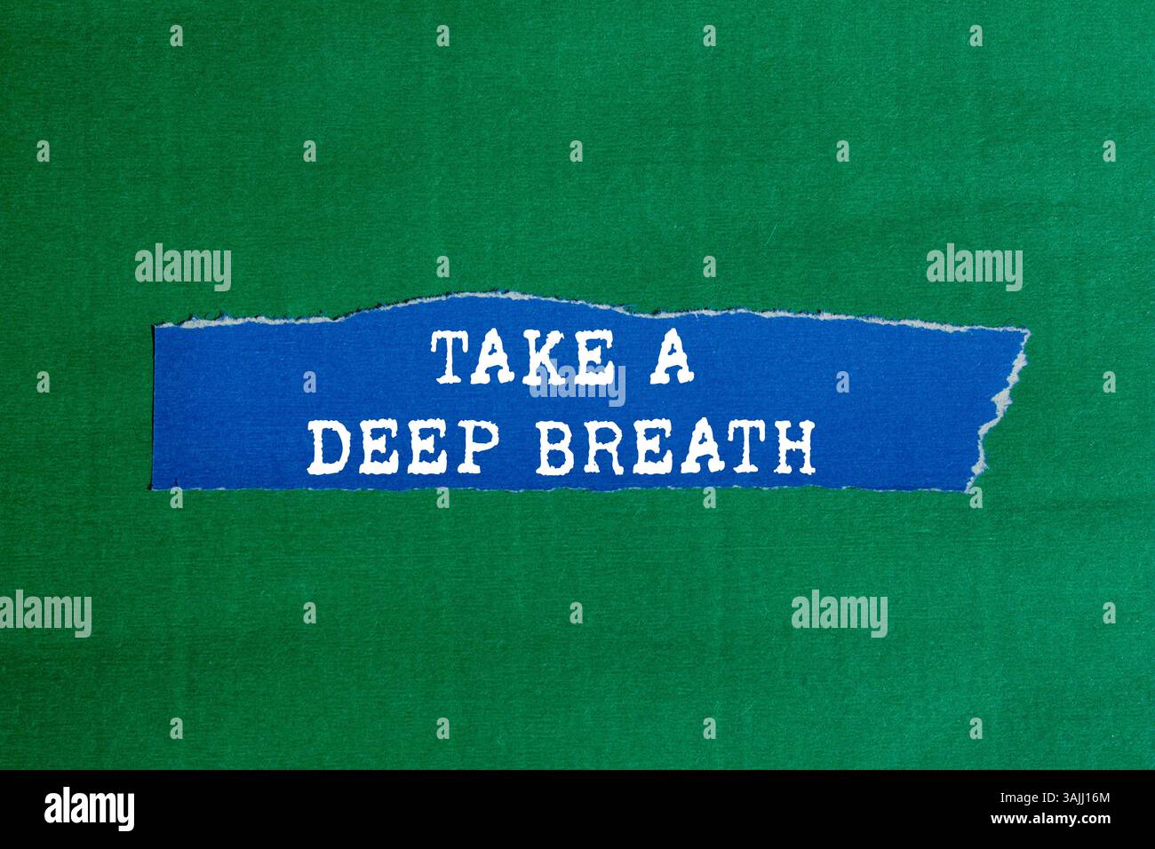 Take a deep breath message written on ripped torn blue paper piece on ...