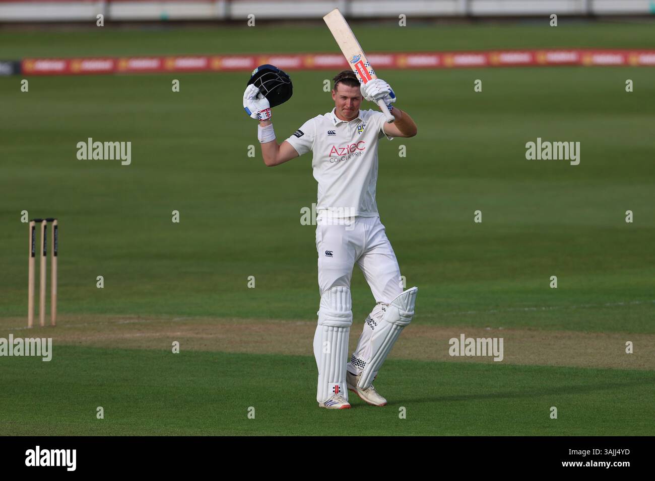 Durham's Ben McKinney celebrates after completing his century during ...