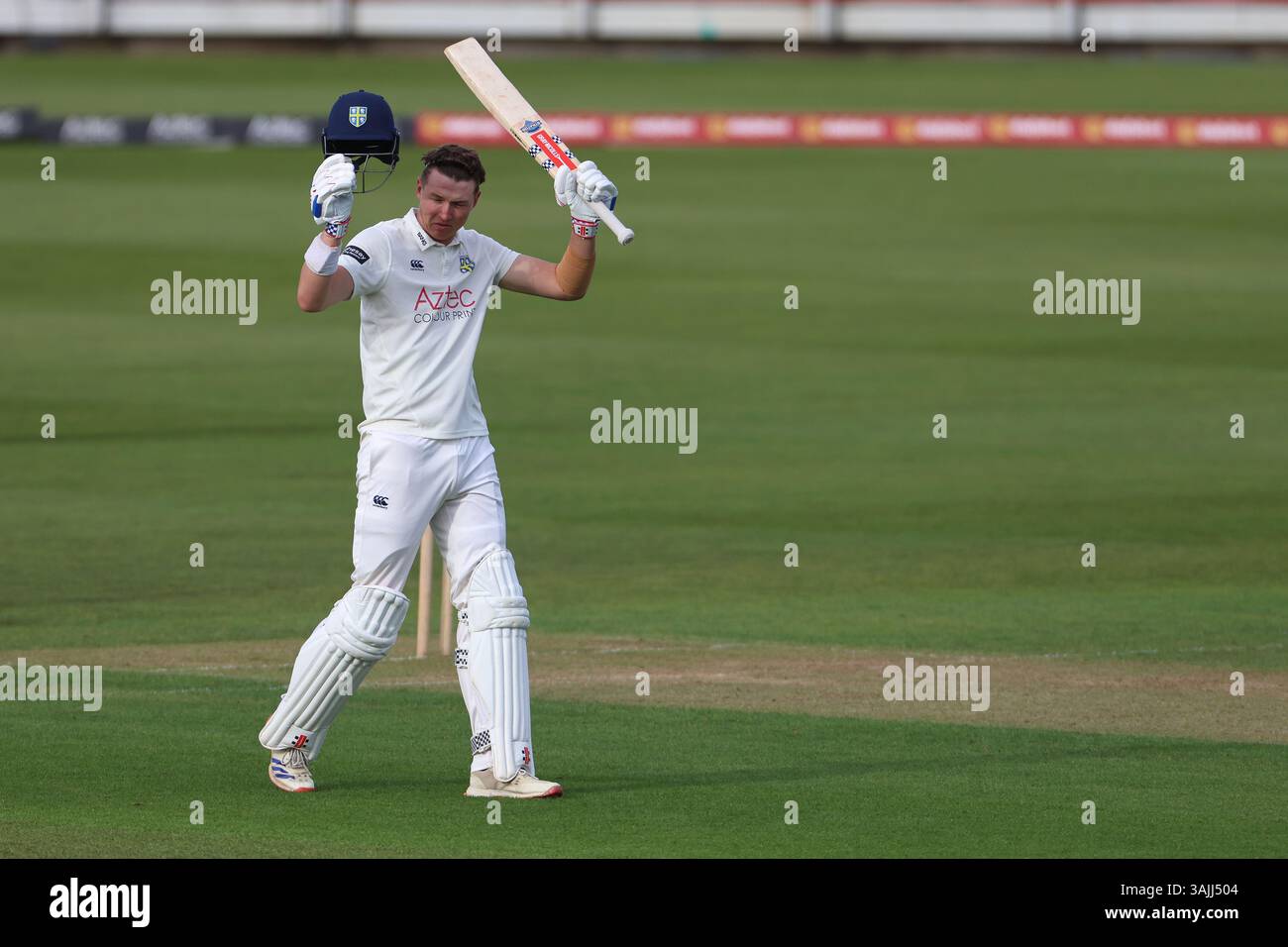 Durham's Ben McKinney celebrates after completing his century during ...