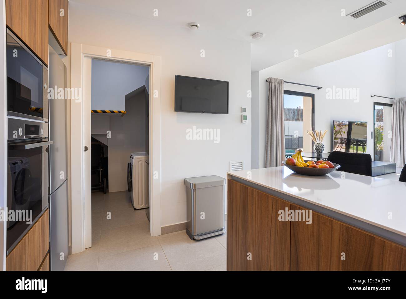 Compact and efficient kitchen space with integrated appliances, white ...