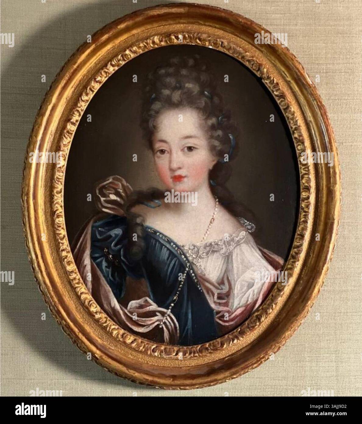 This 17th-century French portrait depicts a young woman, rendered in ...