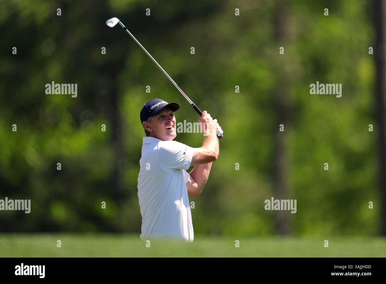 Justin Rose watches his tee shot on the 12th hole during the second ...