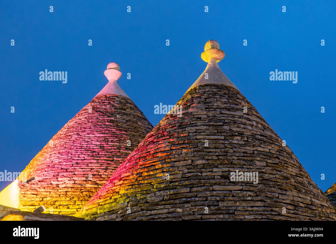 Two illuminated Conical Roofs of Trullo Houses, Alberobello Trulli ...