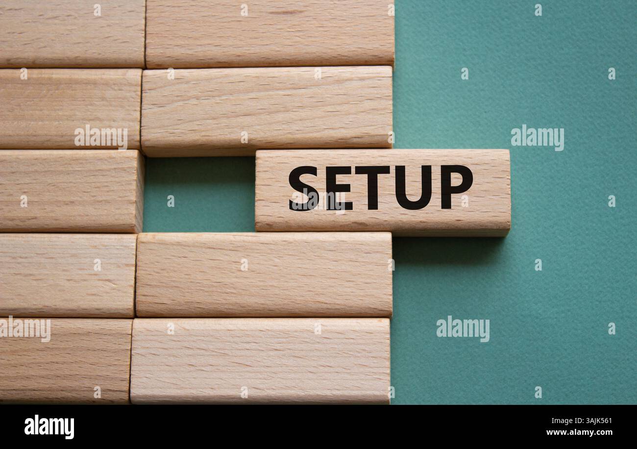 Setup symbol. Wooden blocks with word Setup. Beautiful grey green ...
