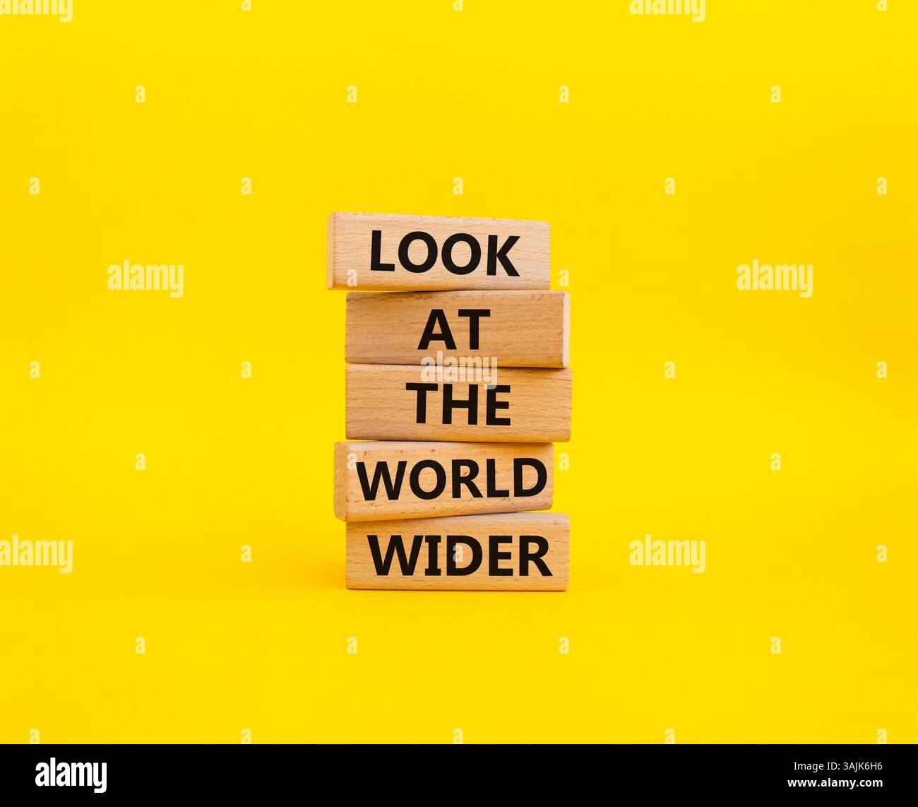 Look at the world wider symbol. Wooden blocks with words Look at the ...