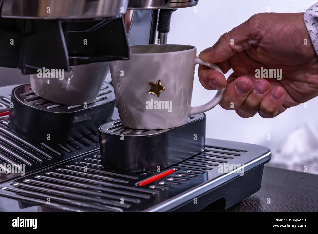 White cup for coffee in a pressure coffee maker, preparation for ...