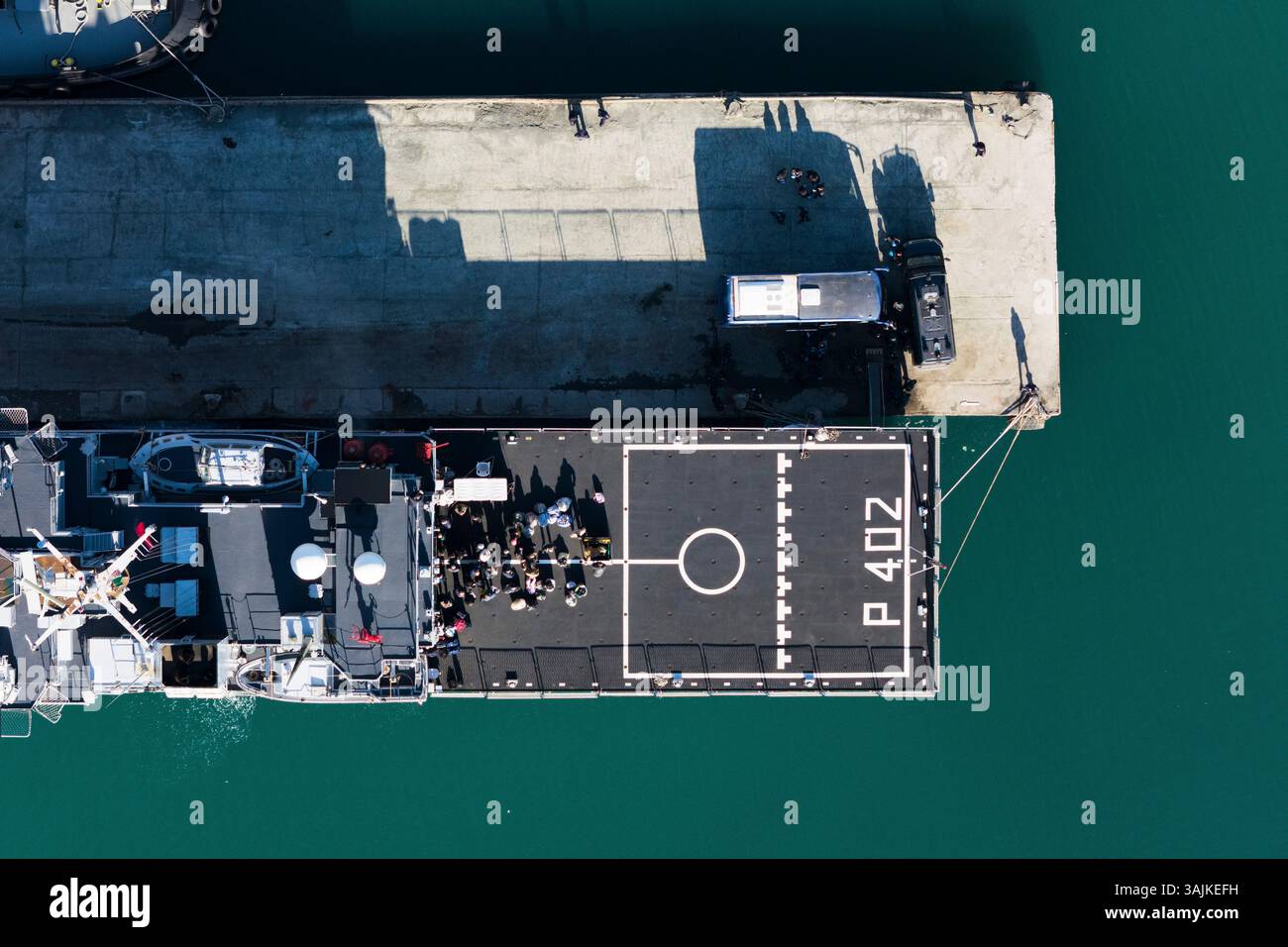 Migrants are waiting to disembarks the Italian navy ship Libra as ...