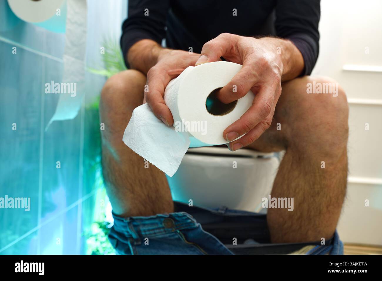 Man on toilet hi-res stock photography and images - Alamy