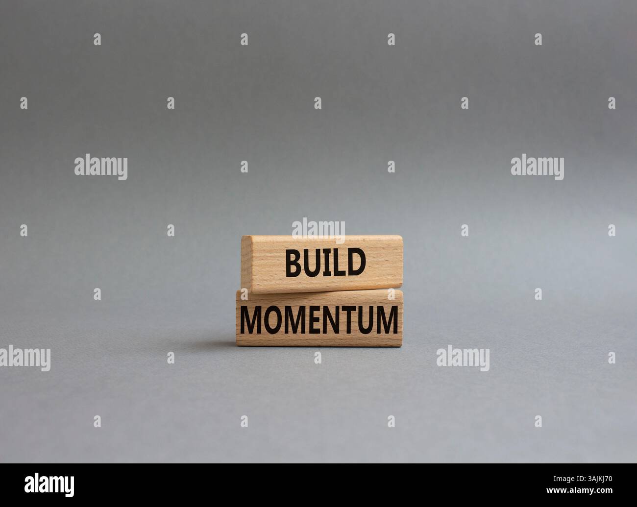 Build momentum symbol. Wooden blocks with words Build momentum ...