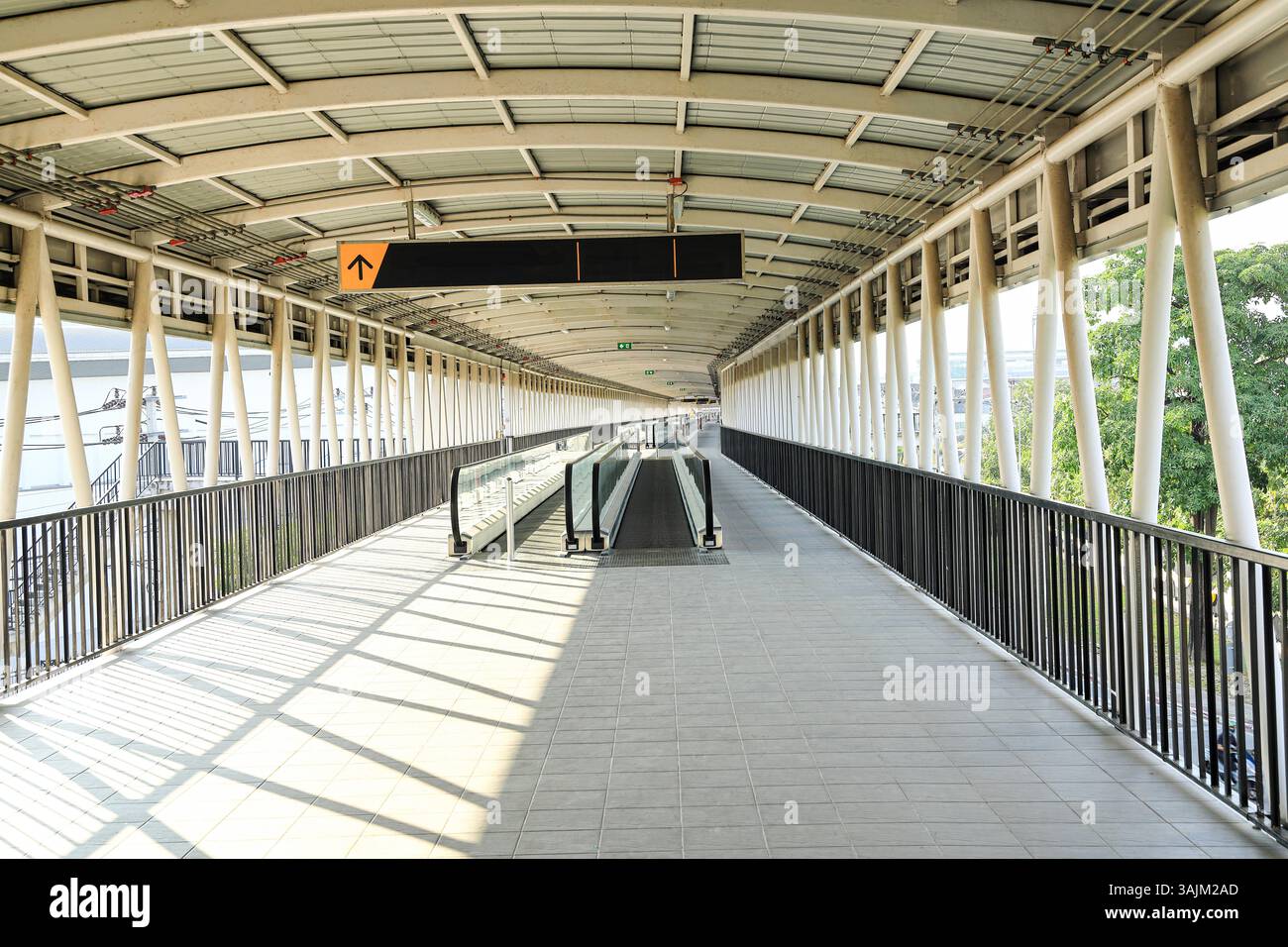 Pedestrian pathway or corridor or hallway between train station and ...