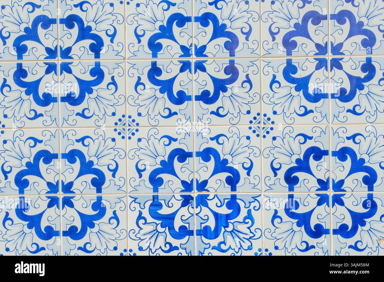 Traditional Portuguese azulejo tiles featuring an intricate blue and ...