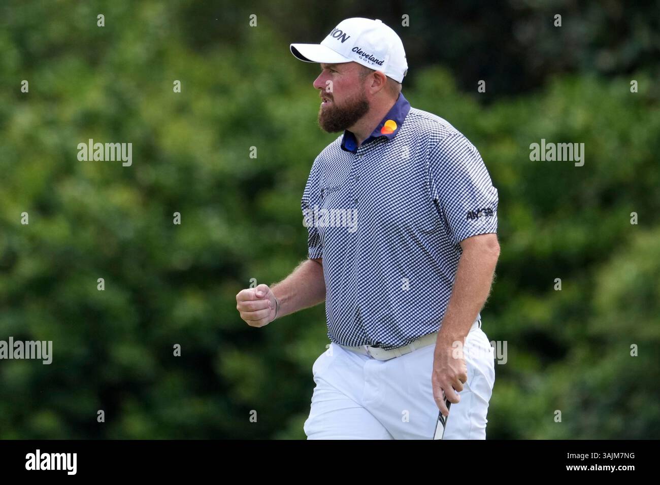 Shane Lowry, of Ireland, celebrates after a birdie on the 11th hole ...