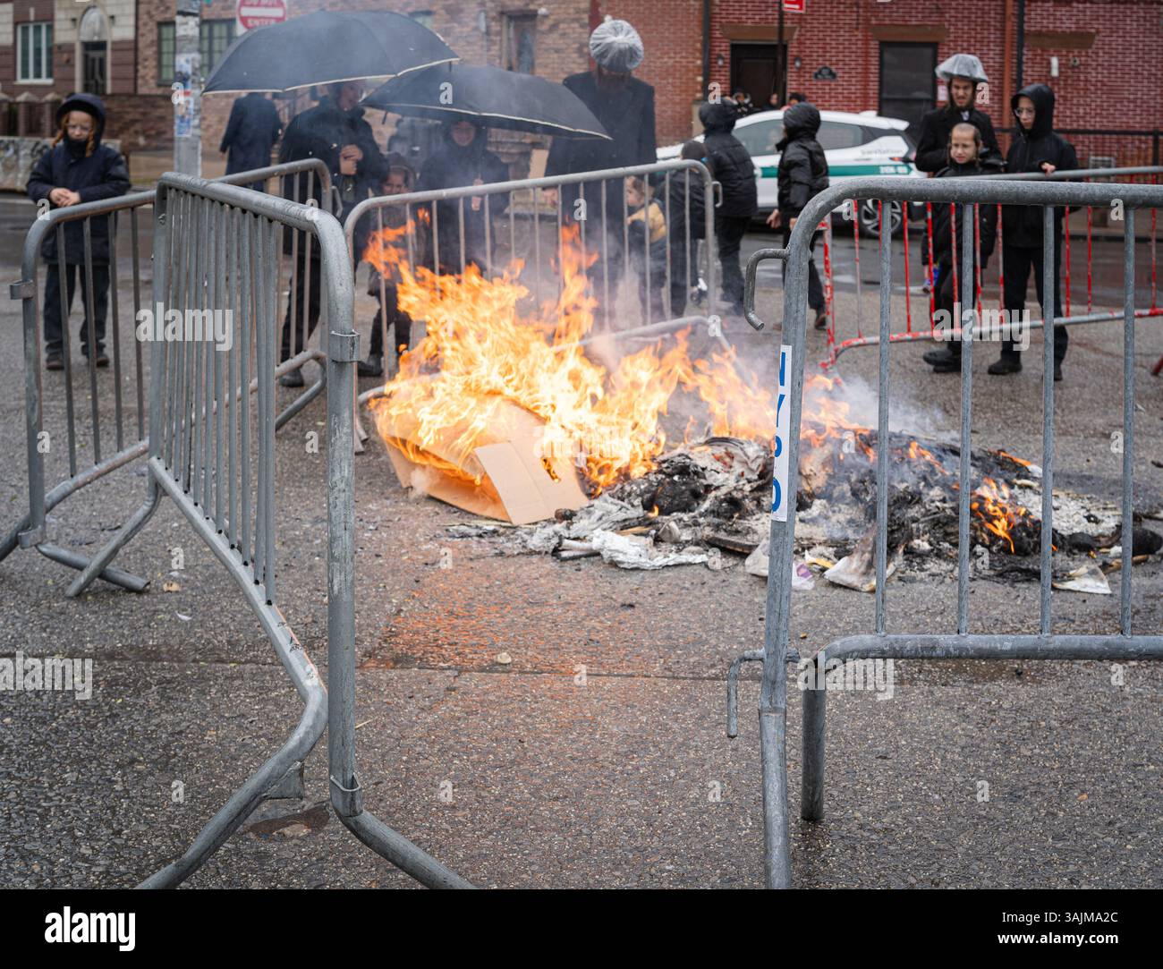 Members of the Jewish community participate in the burning of the bread ...