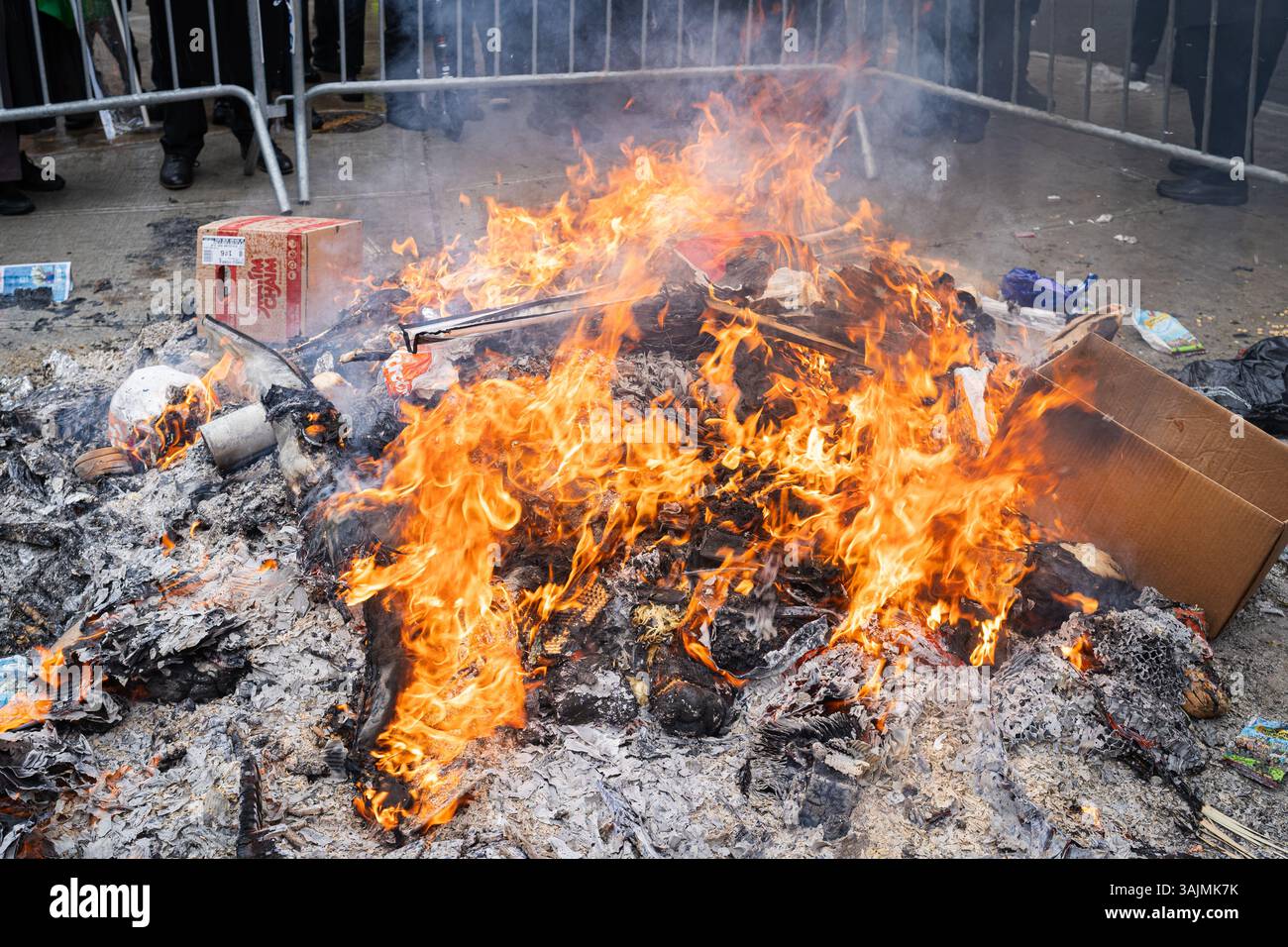 Members of the Jewish community participate in the burning of the bread ...