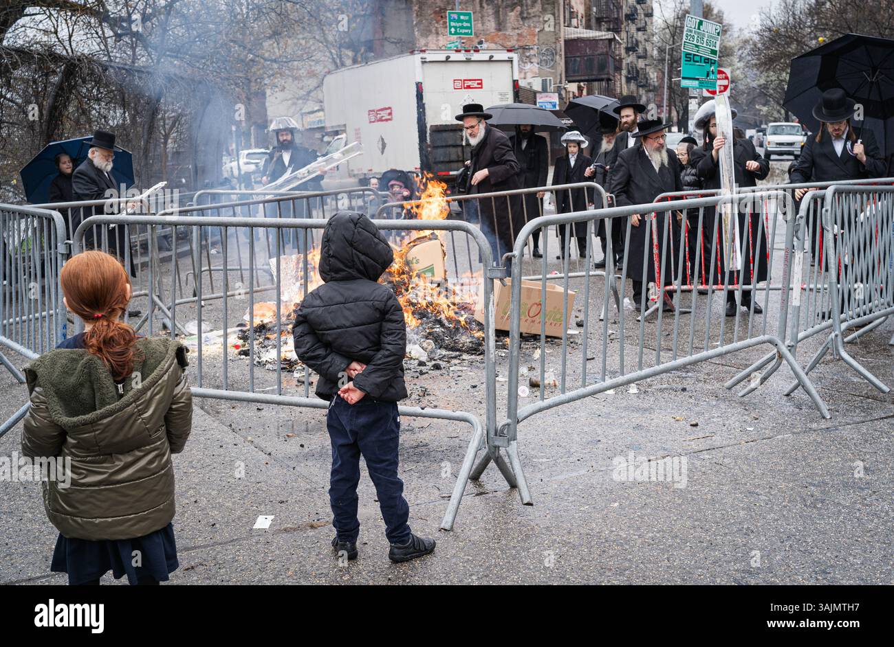 Members of the Jewish community participate in the burning of the bread ...
