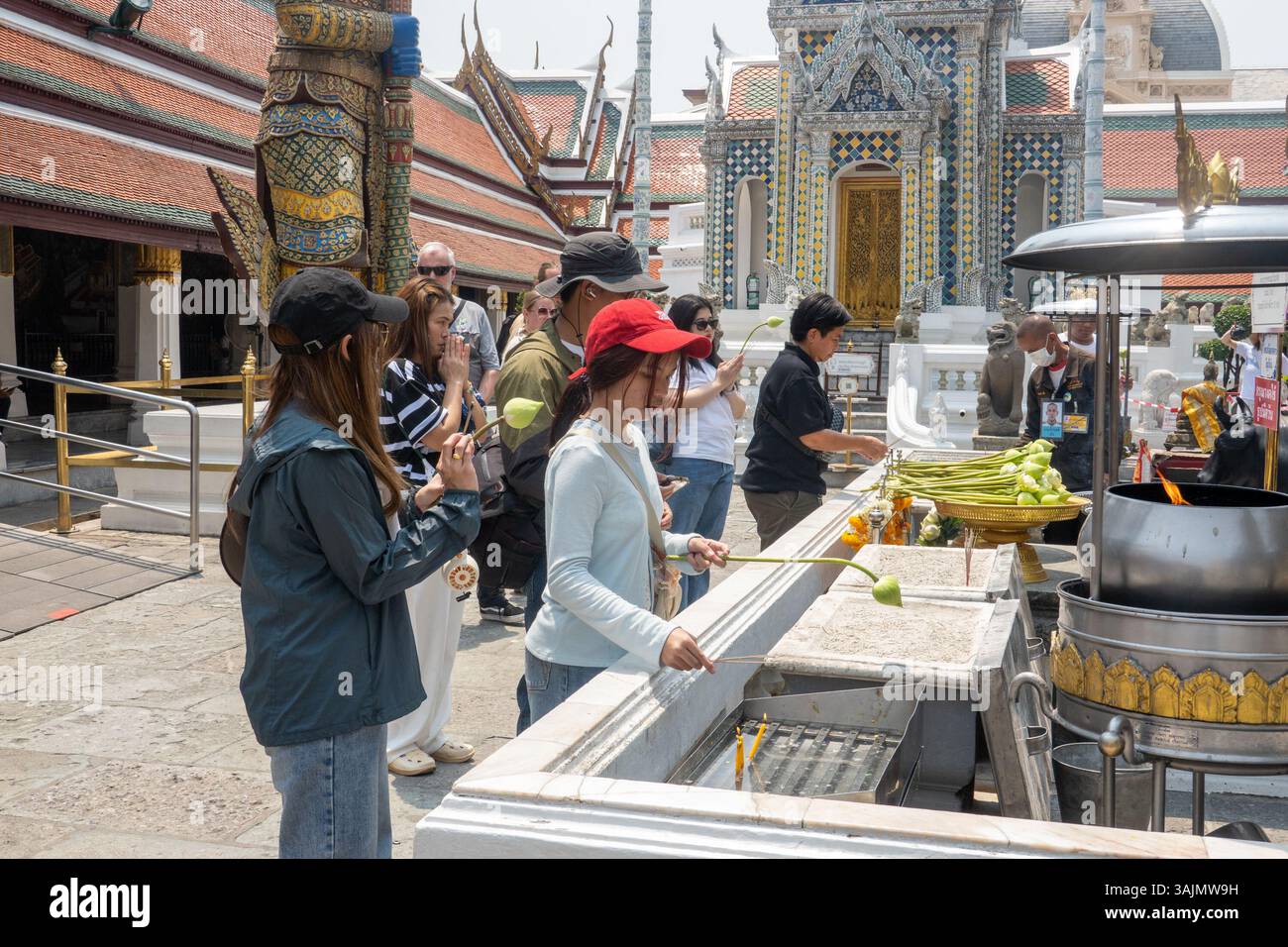 People pray at The Grand Palace in Bangkok, a stunning complex of ...