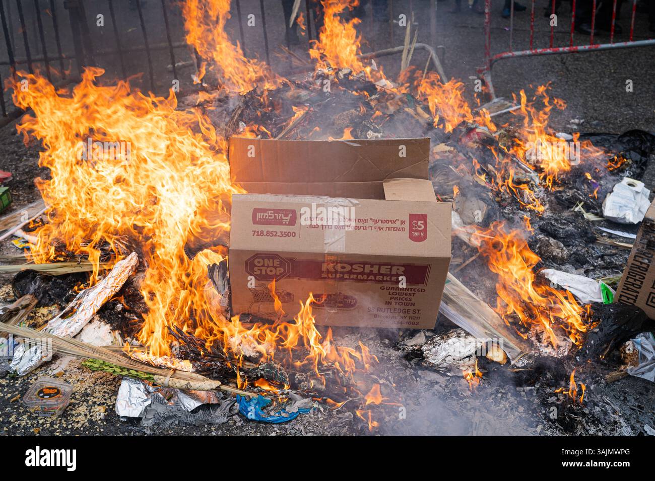 Members of the Jewish community participate in the burning of the bread ...