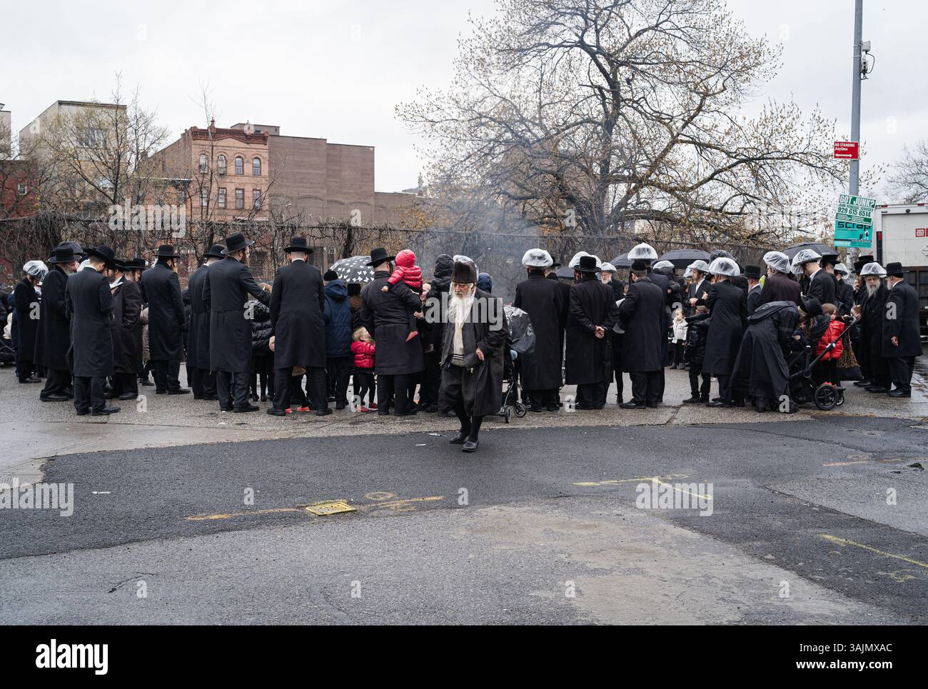 Members of the Jewish community participate in the burning of the bread ...