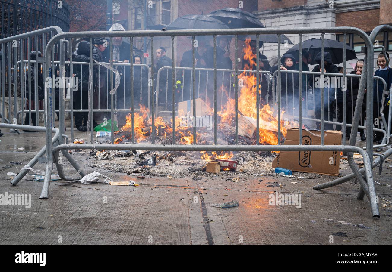 Members of the Jewish community participate in the burning of the bread ...