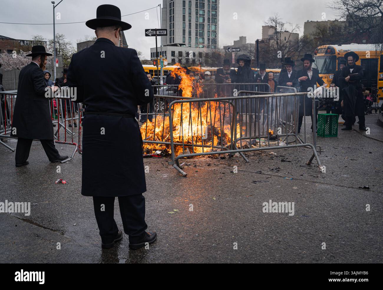 Members of the Jewish community participate in the burning of the bread ...