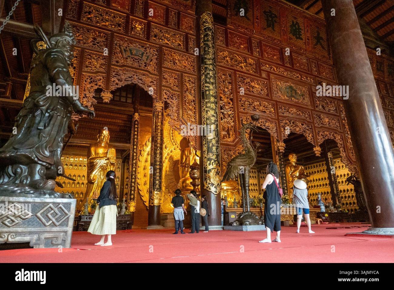 Tourists visit Asia's largest gold-plated bronze Buddha statue ...