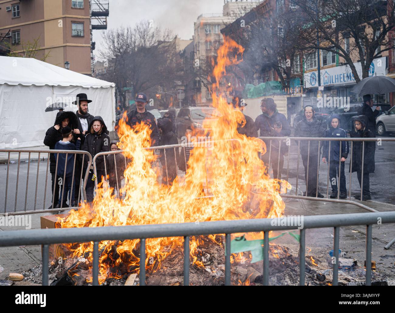 Members of the Jewish community participate in the burning of the bread ...