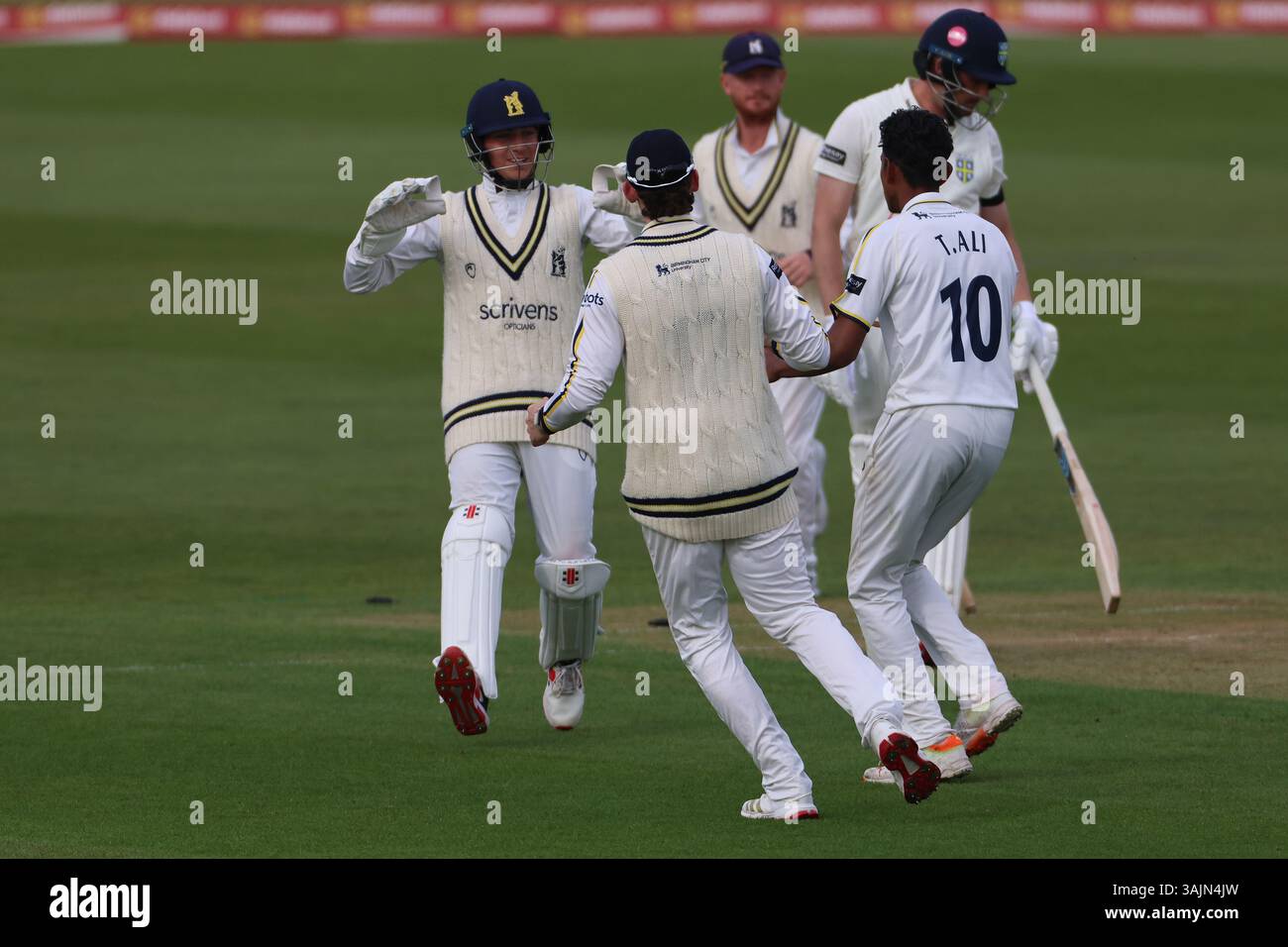 Warwickshire's Tazeem Ali celebrates with his team mates after bowling ...