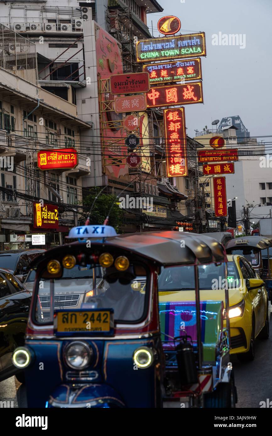 Bangkok, Thailand. March 26th 2025. Tuk Tuk taxis and busy traffic in the chaotic streets of ...