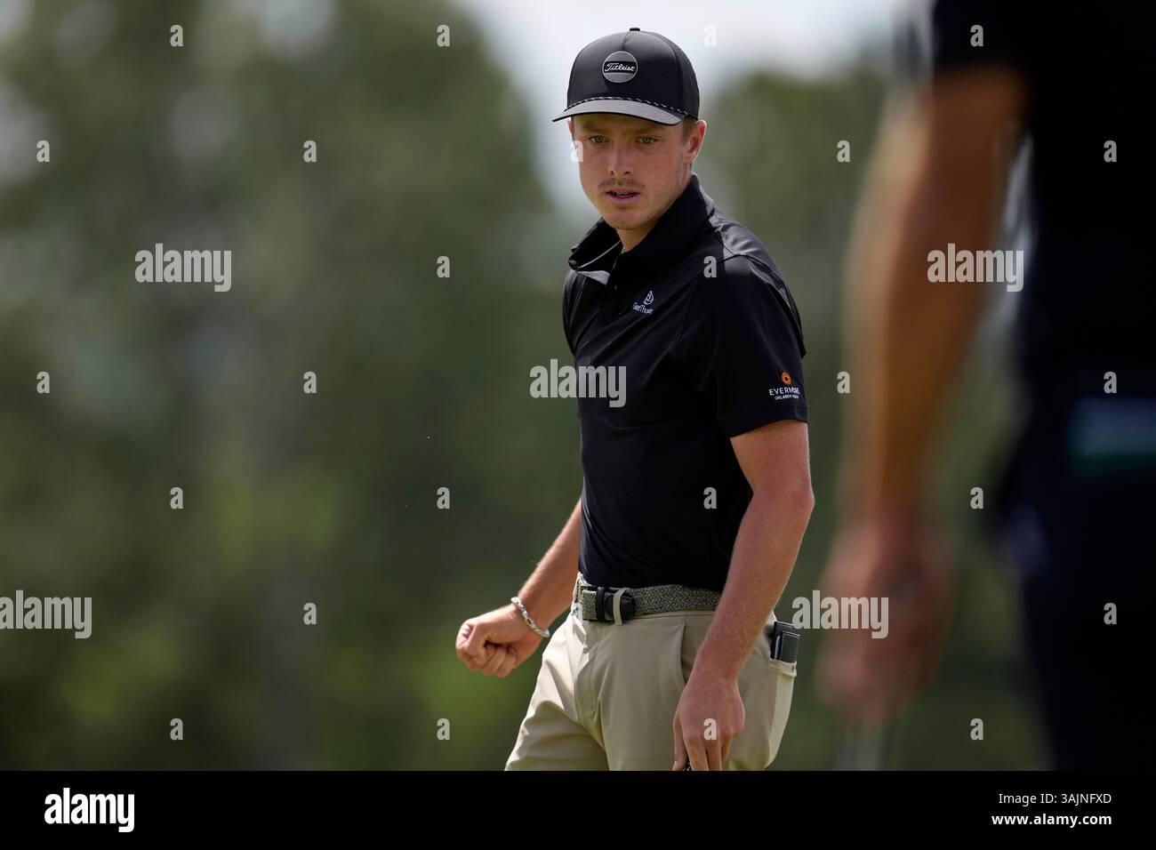 Justin Hastings, of Cayman Islands, celebrates after a birdie on the ...