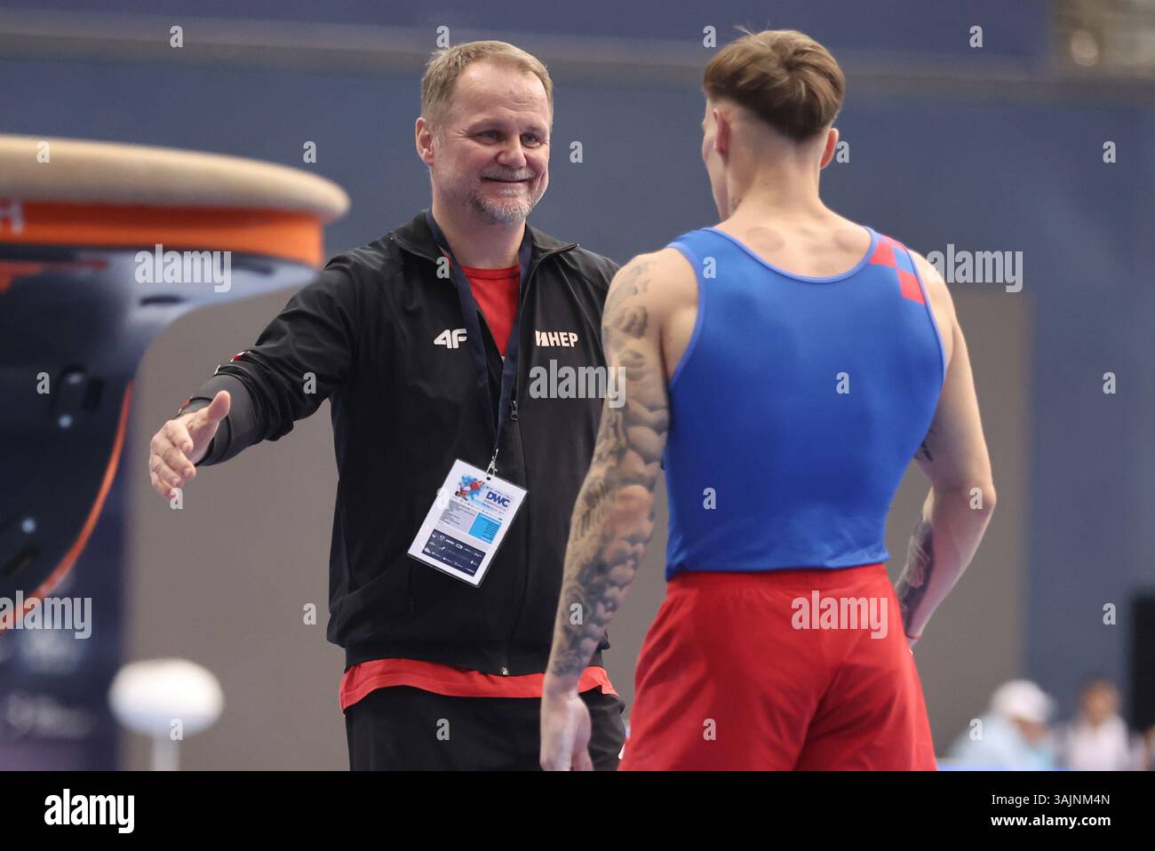 Aurel Benovic of Croatia and his coach Vladimir Madjarevic after his ...