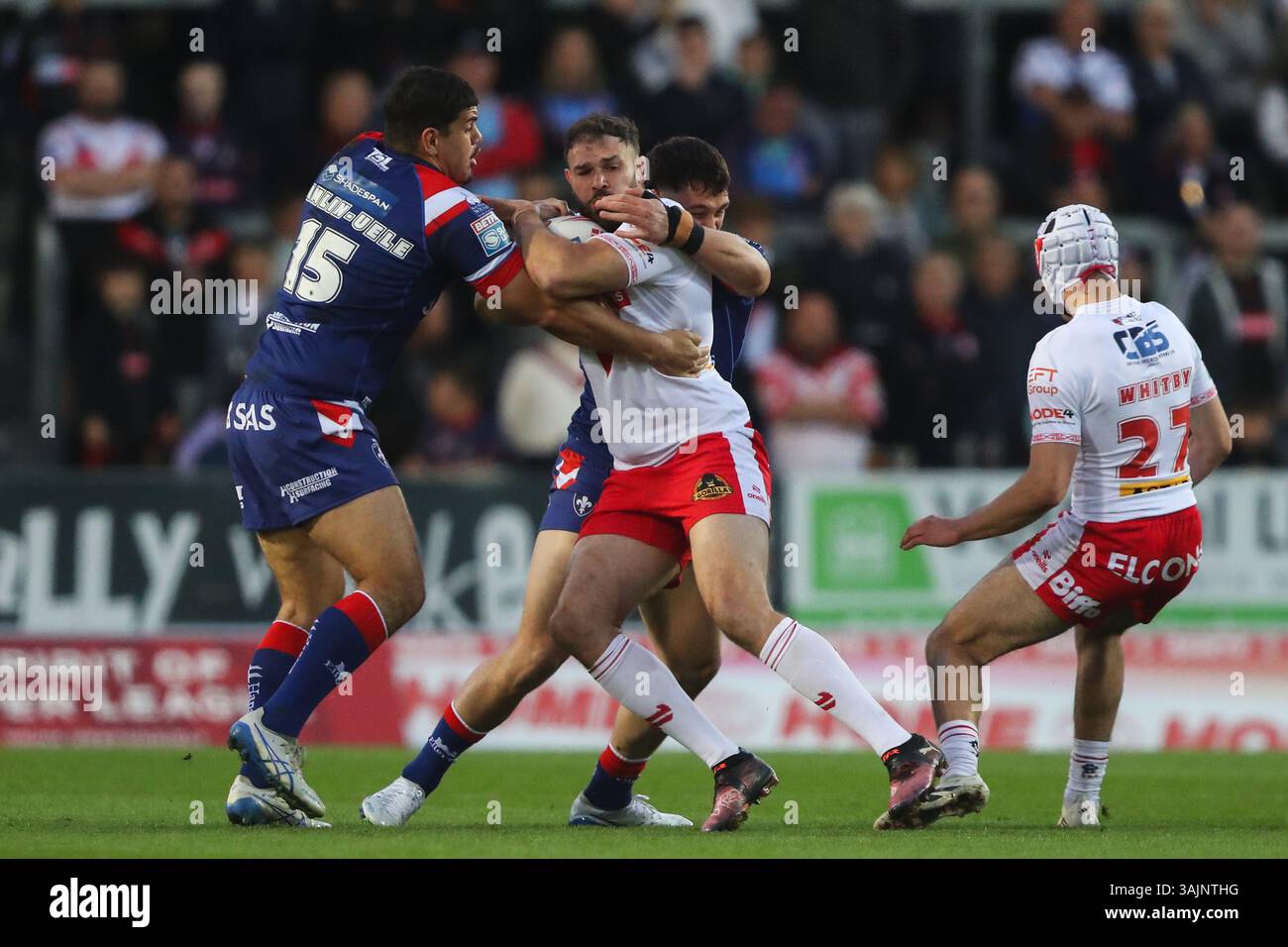 St Helens, UK. 11th Apr, 2025. Alex Walmsley of St. Helens is tackled ...