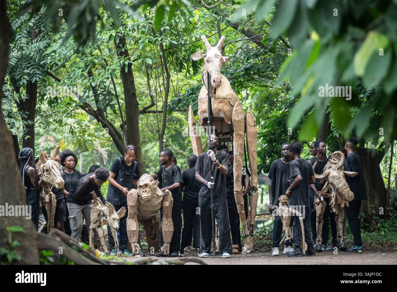 Puppeteers move cardboard animals through DRC's capital Kinshasa's ...
