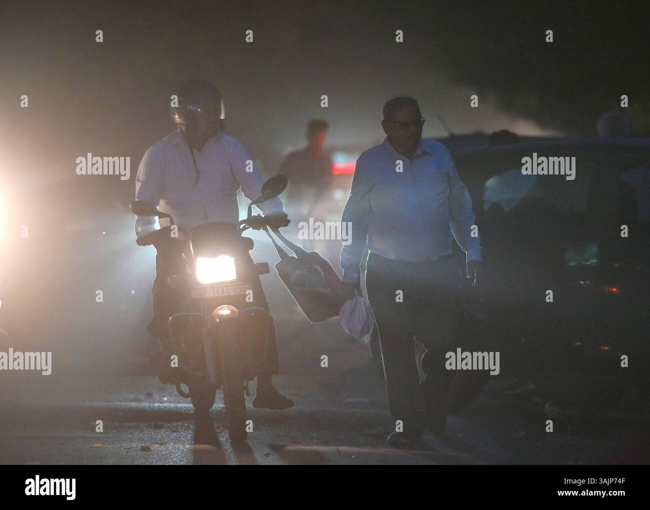NOIDA, INDIA - APRIL 11: Commuters during a dust storm at Sector 12 ...