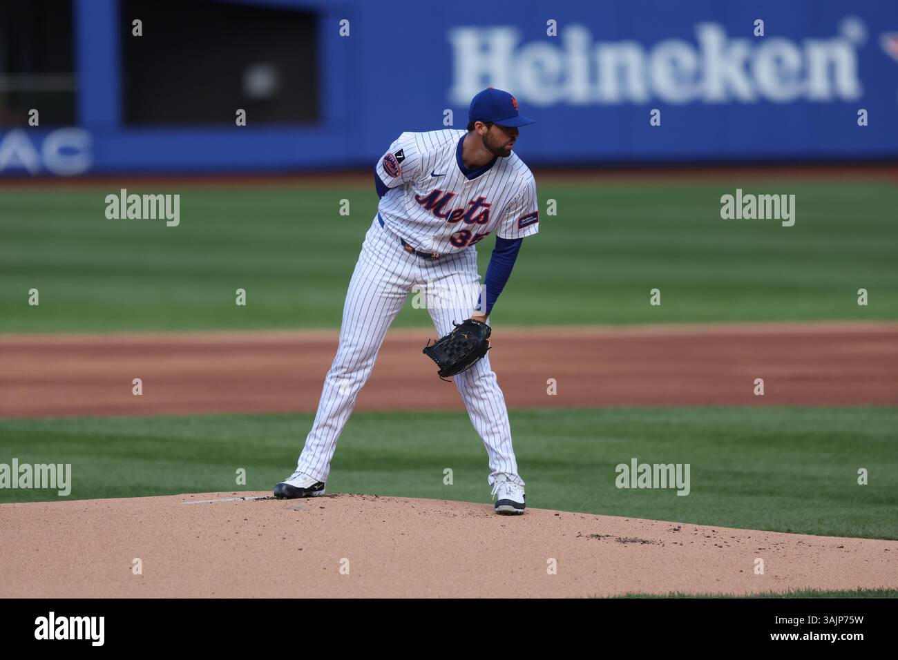 New York Mets starting pitcher Clay Holmes #35 throws during the first inning of a baseball game ...