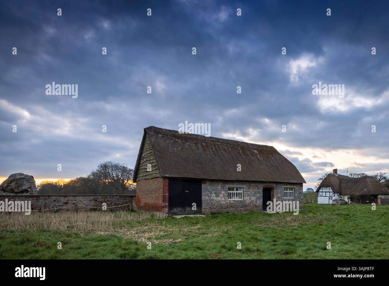 Old stone barn with thatched roof, Avebury, Wiltshire, England Stock ...
