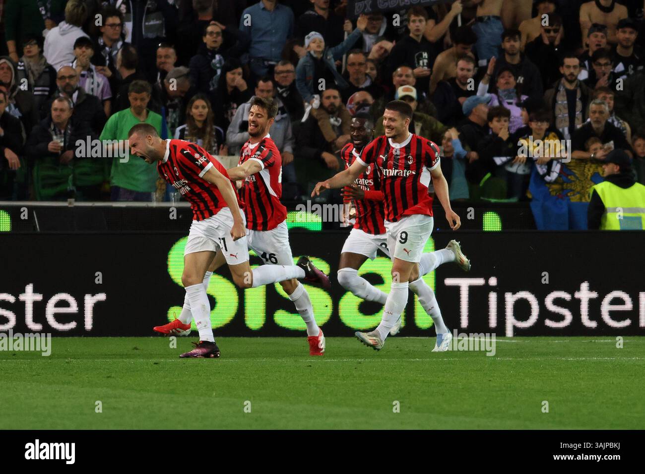 Udine, Italia. 11th Apr, 2025. AC Milan's Strahinja Pavlovic celebrates ...