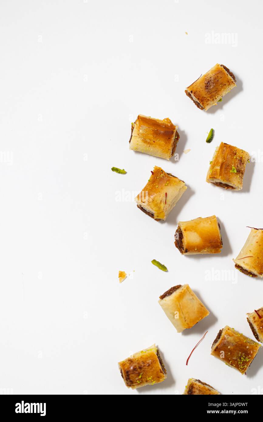 Crispy Phyllo Pastries with Date Puree Filling and Pistachio Garnish on ...
