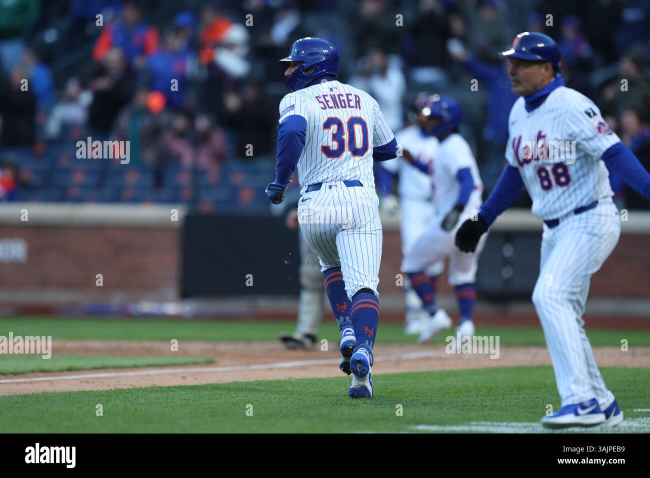 New York Mets Hayden Senger #30 scores during the sixth inning of a ...