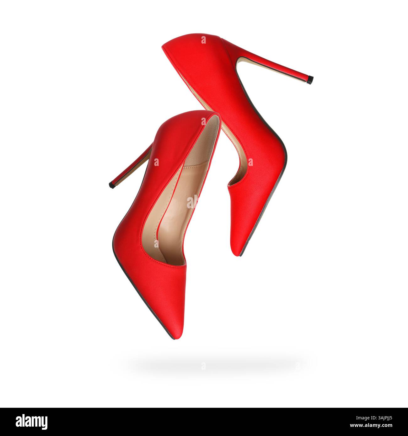 Stylish red high heel shoes in air on white background Stock Photo - Alamy