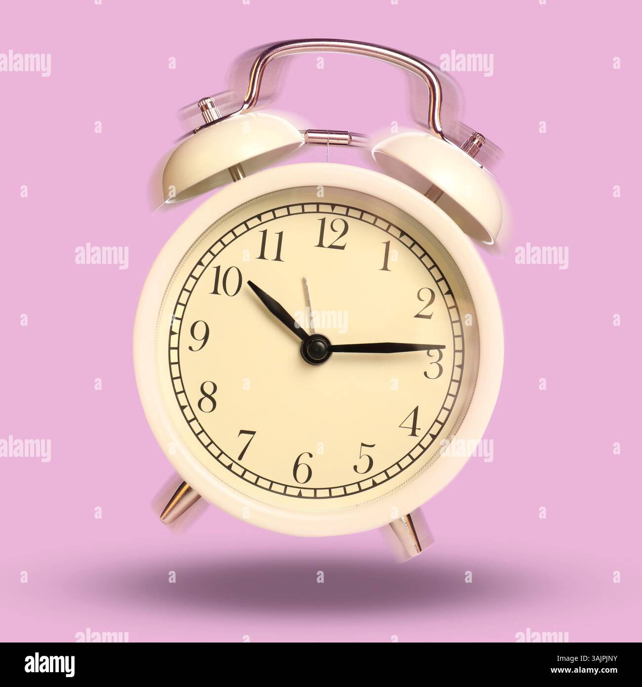 Alarm clock ringing and jumping on light violet background Stock Photo ...