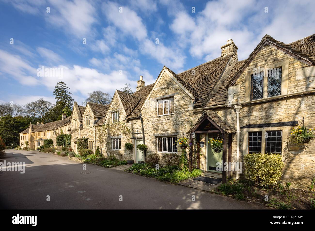 A row of Cotswold stone cottages in Castle Combe, Wiltshire, England ...
