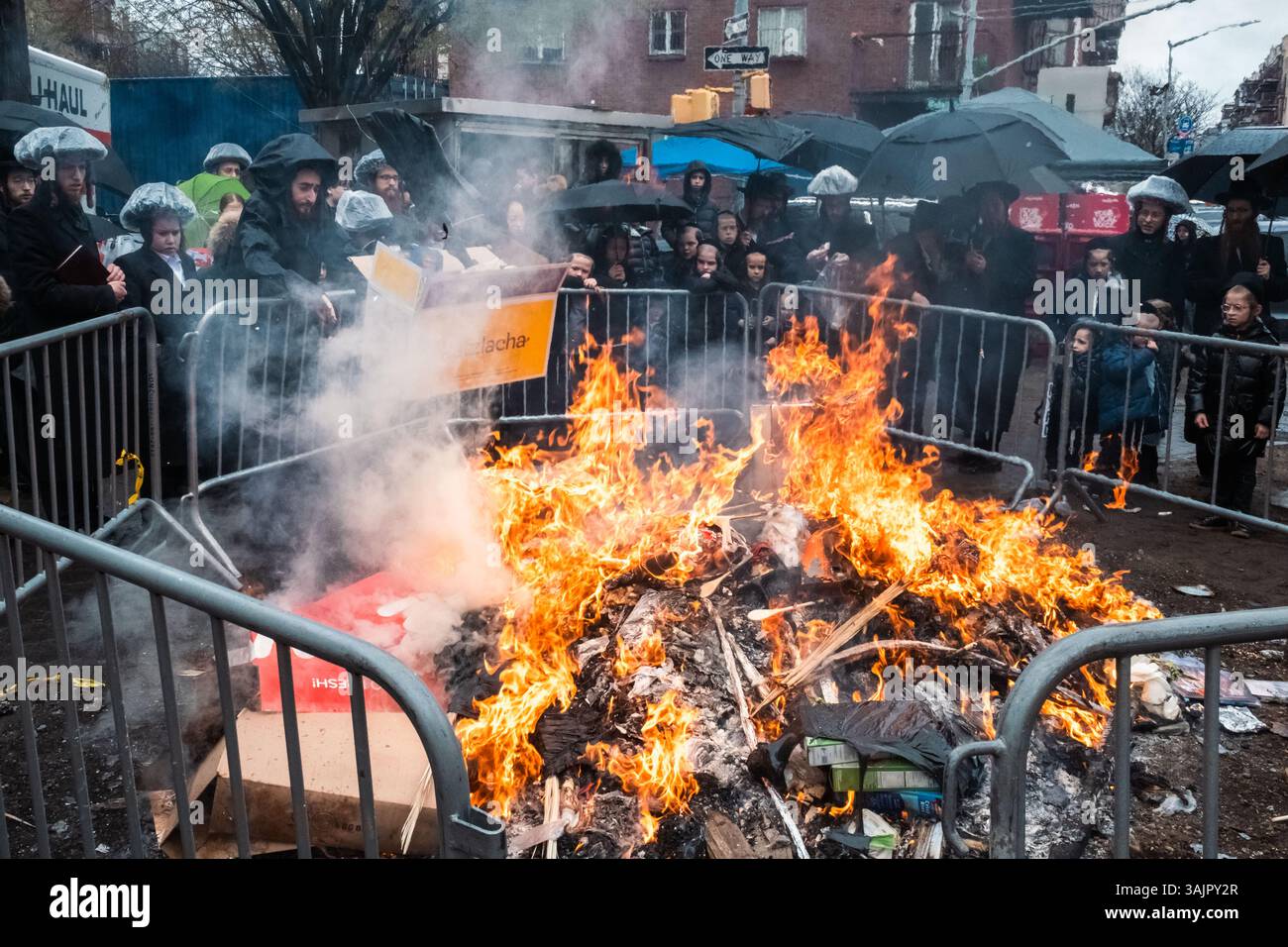 Williamsburg, United States. 11th Apr, 2025. A man tosses a box into ...