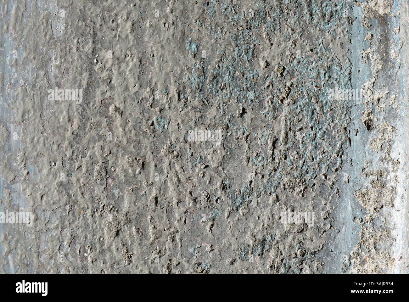 Close up of distressed wall with chipped white paint stained surface ...