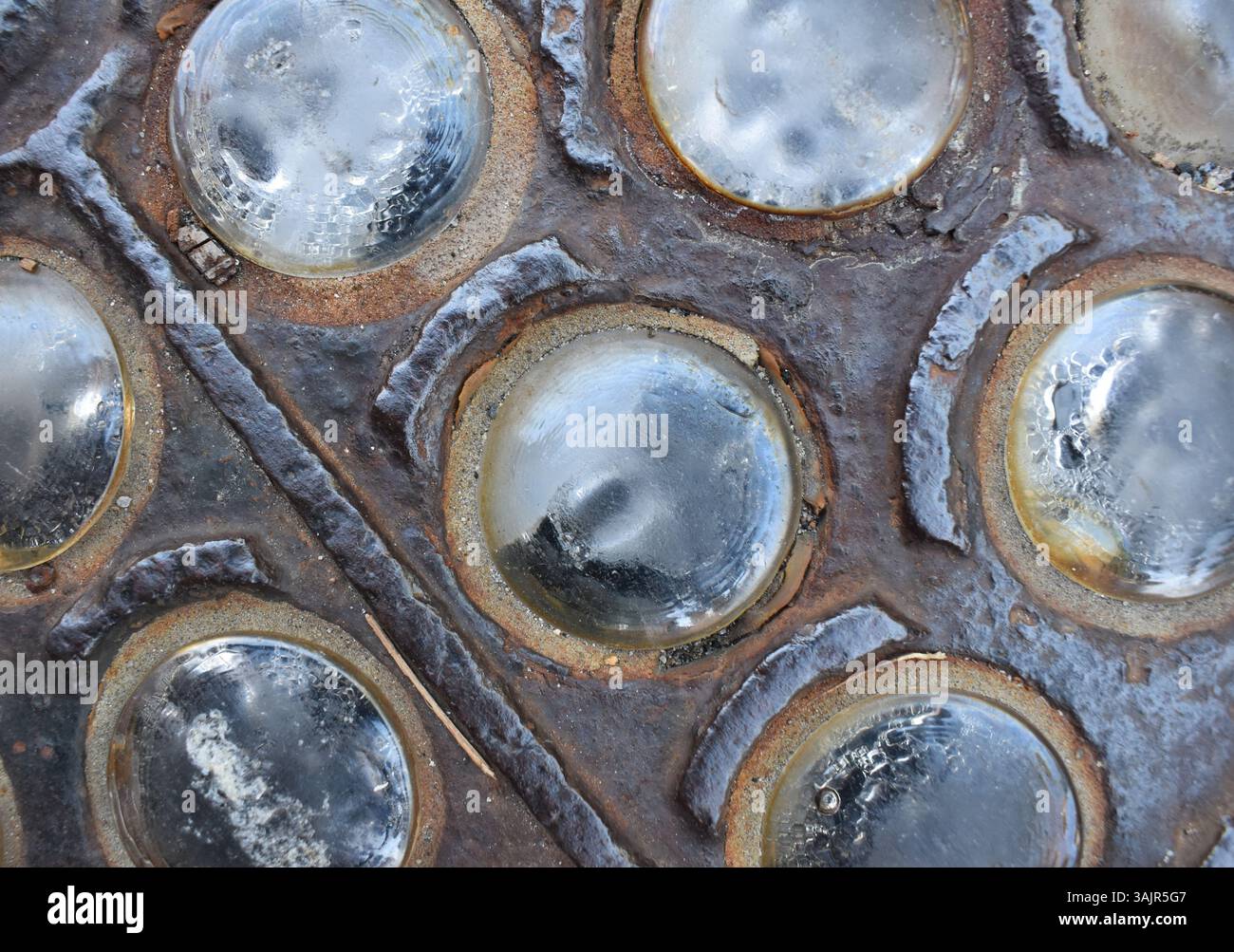 Old rusty metal background with round glass windows and dirty texture ...