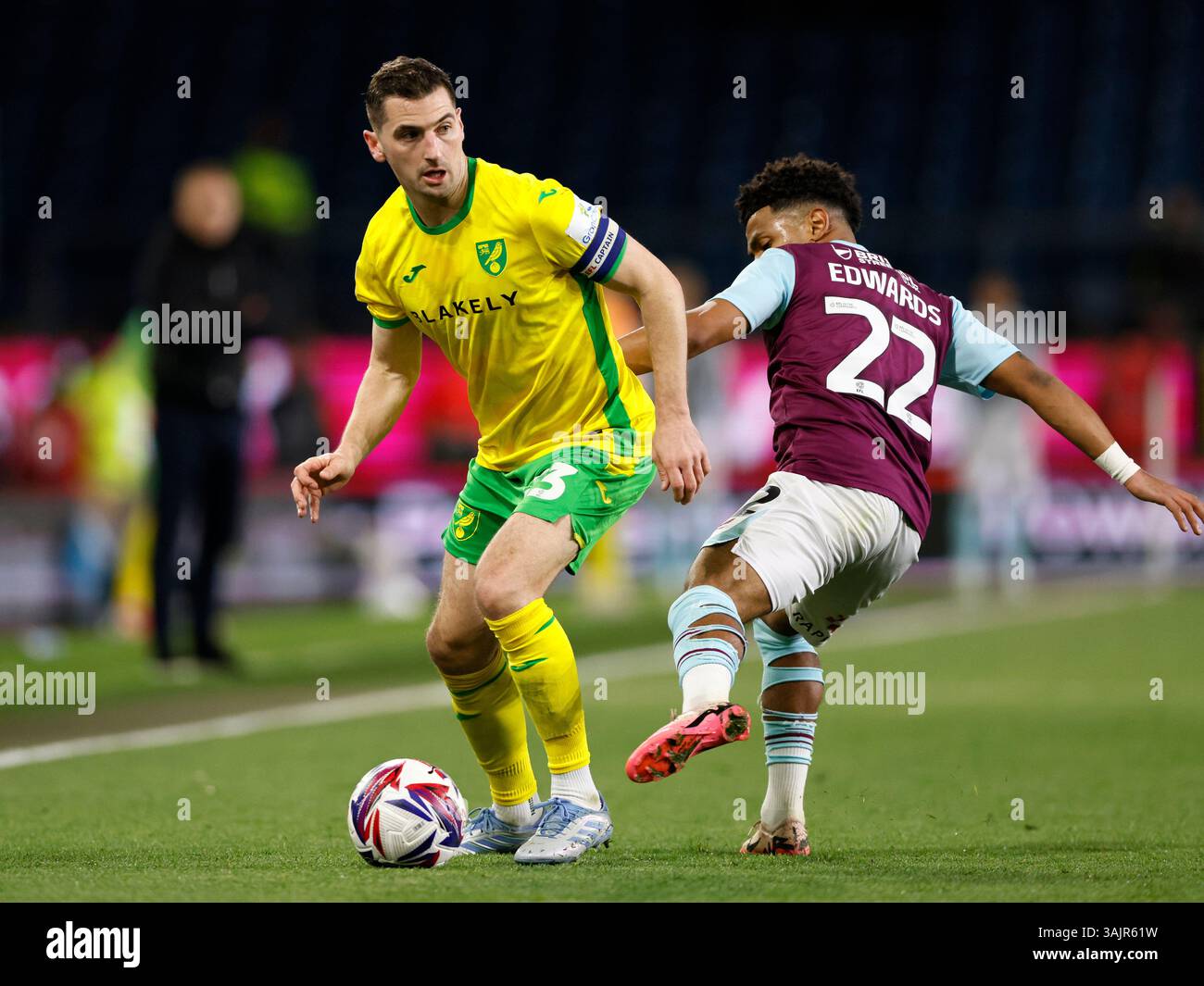 Norwich City's Kenny McLean (left) and Burnley's Marcus Edwards battle ...