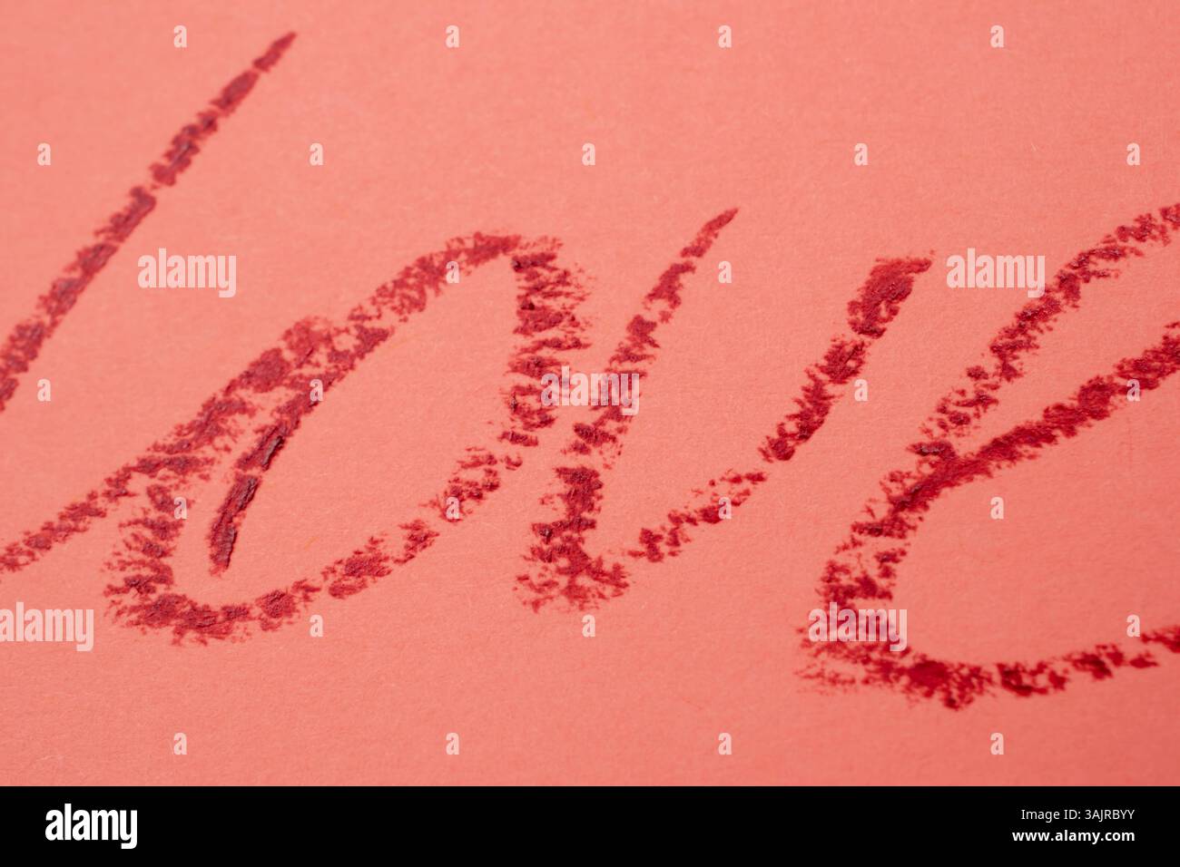 "Love" in bold red lipstick lettering on a soft pink background exudes ...