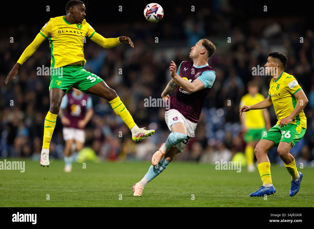Burnley's Ashley Barnes (centre) and Norwich City's Jose Cordoba (left ...