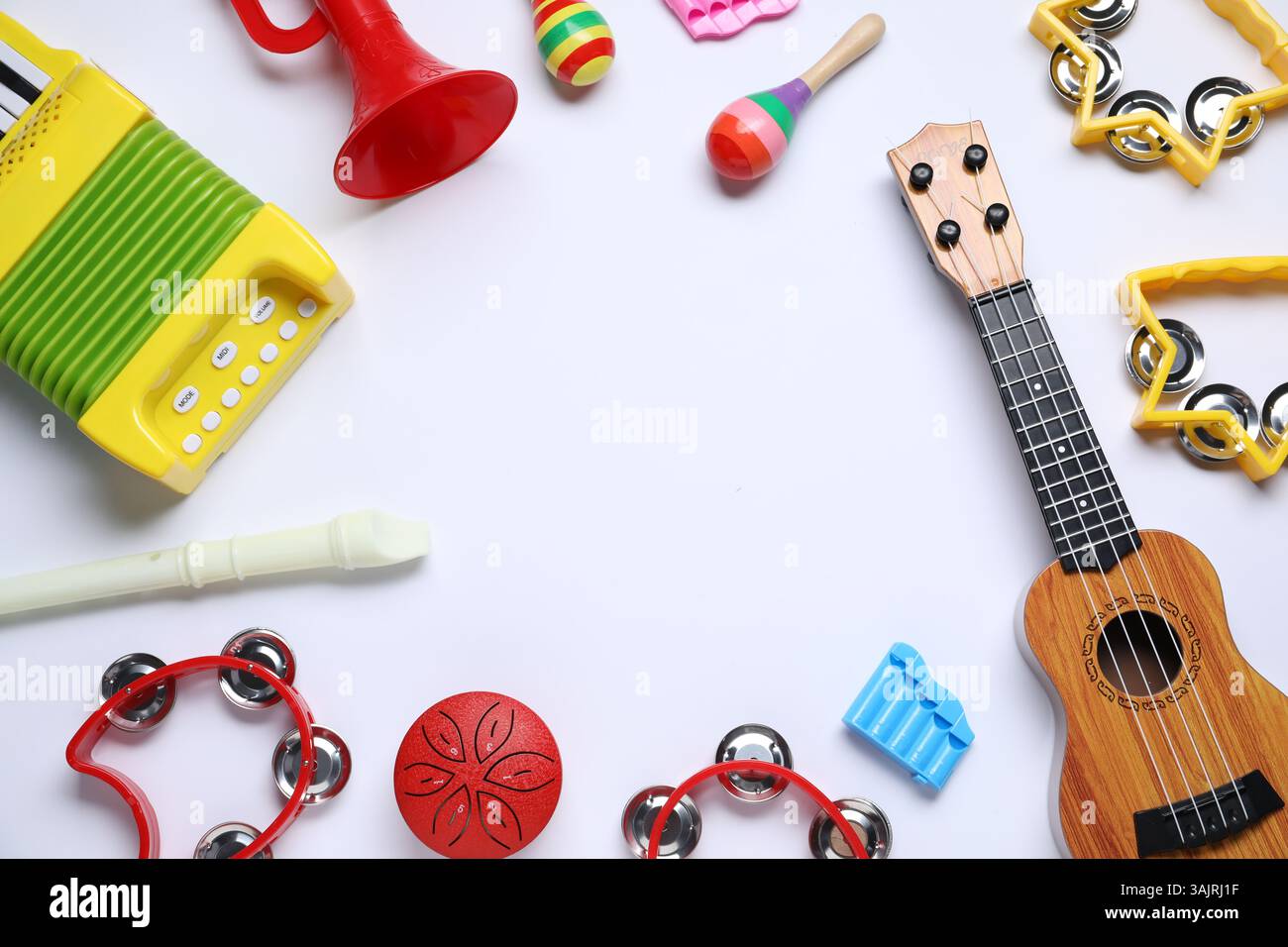 Frame of different toy musical instruments on white background, flat ...