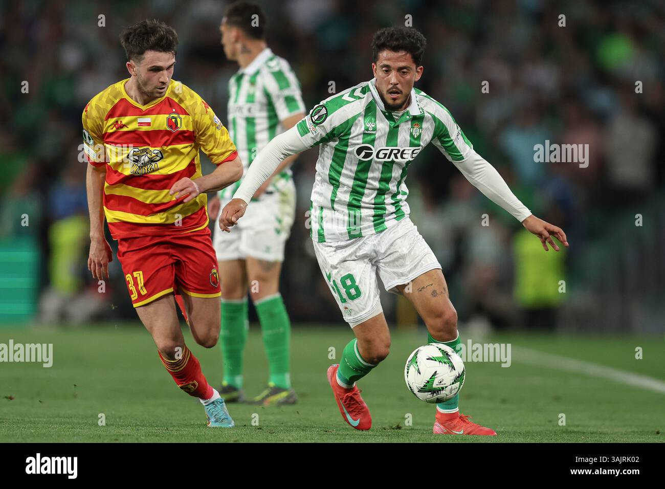 Sevilla, Spain. 10th Apr, 2025. Pablo Fornals of Real Betis and Leon Flach of Jagiellonia ...